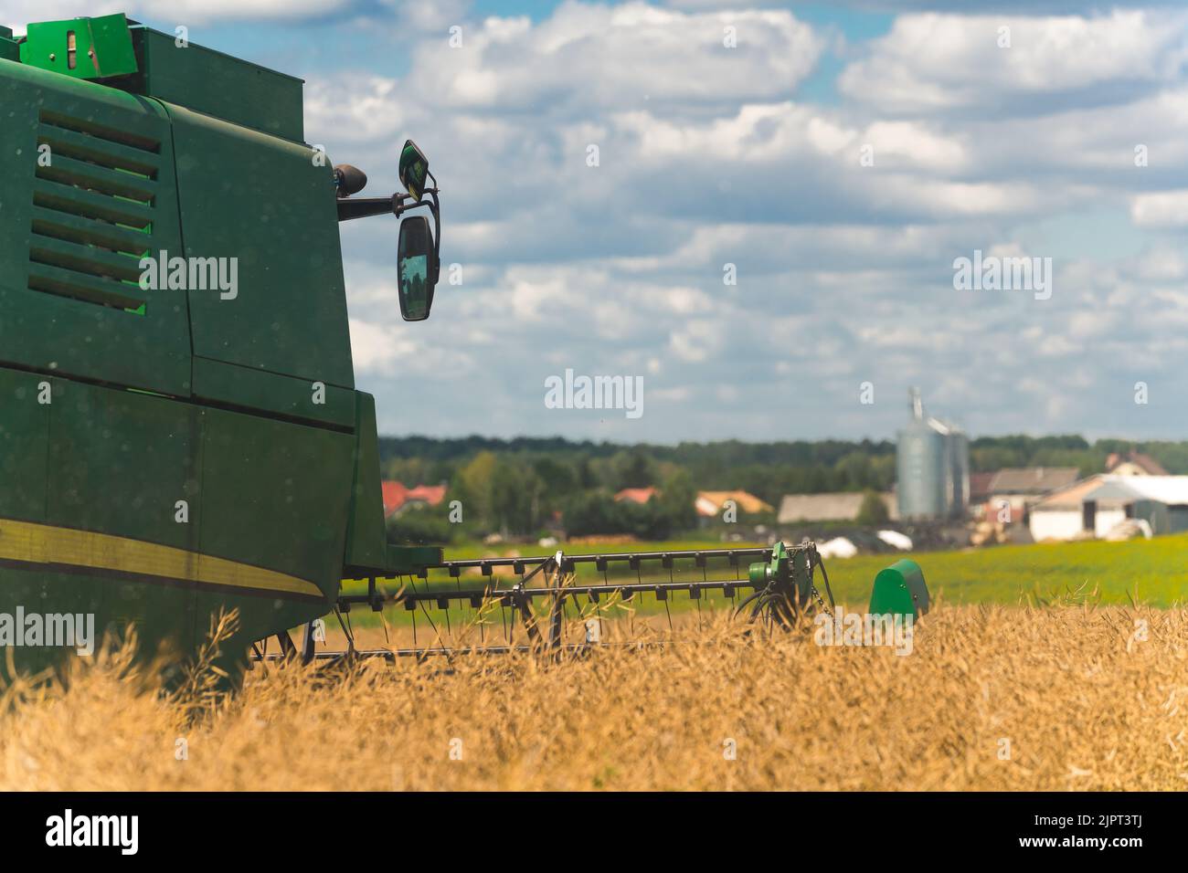The back of modern green-colored combine harvester and its reel ...