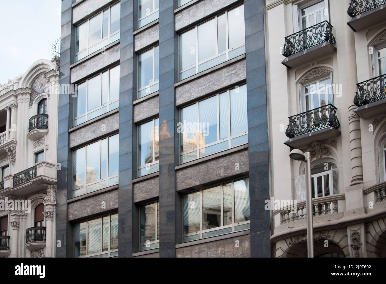 The beautiful stone buildings balconies and windows on Gran via street ...