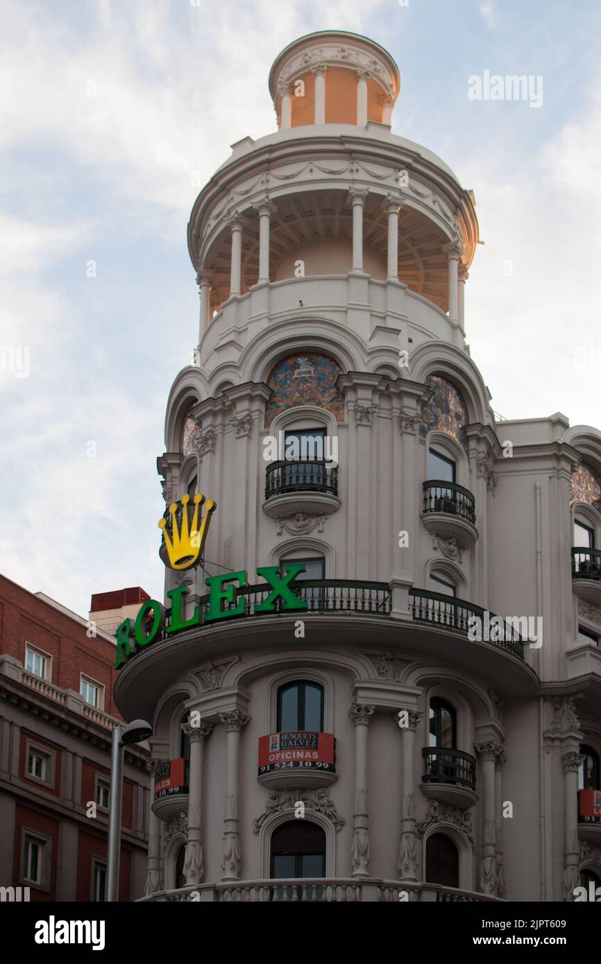 A vertical shot of Edificio Grassy building on Gran via street. Madrid ...