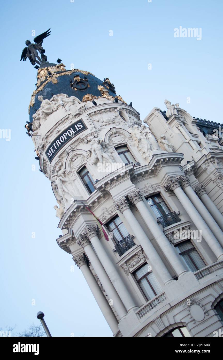 A vertical shot of Metropolis Building with the winged victory topping ...