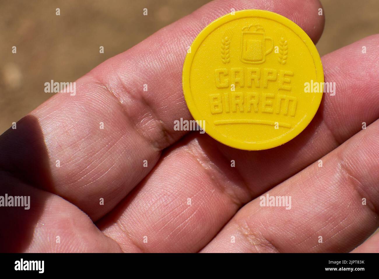 CAMBRILS, SPAIN - JUNE 5, 2022: plastic coin Carpe birrem Translation ...