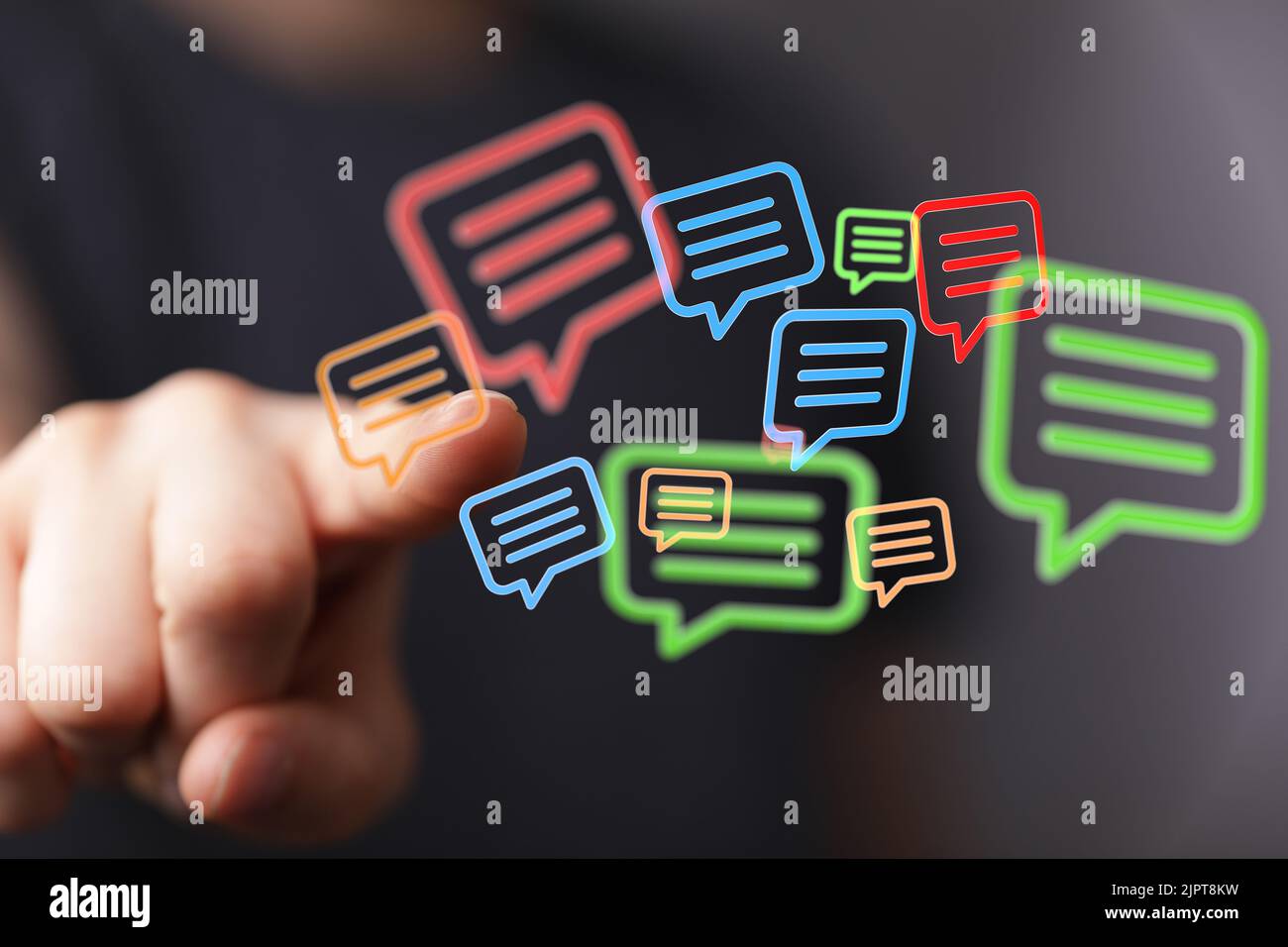 A hand pointing to colorful digital message symbols with a finger Stock ...