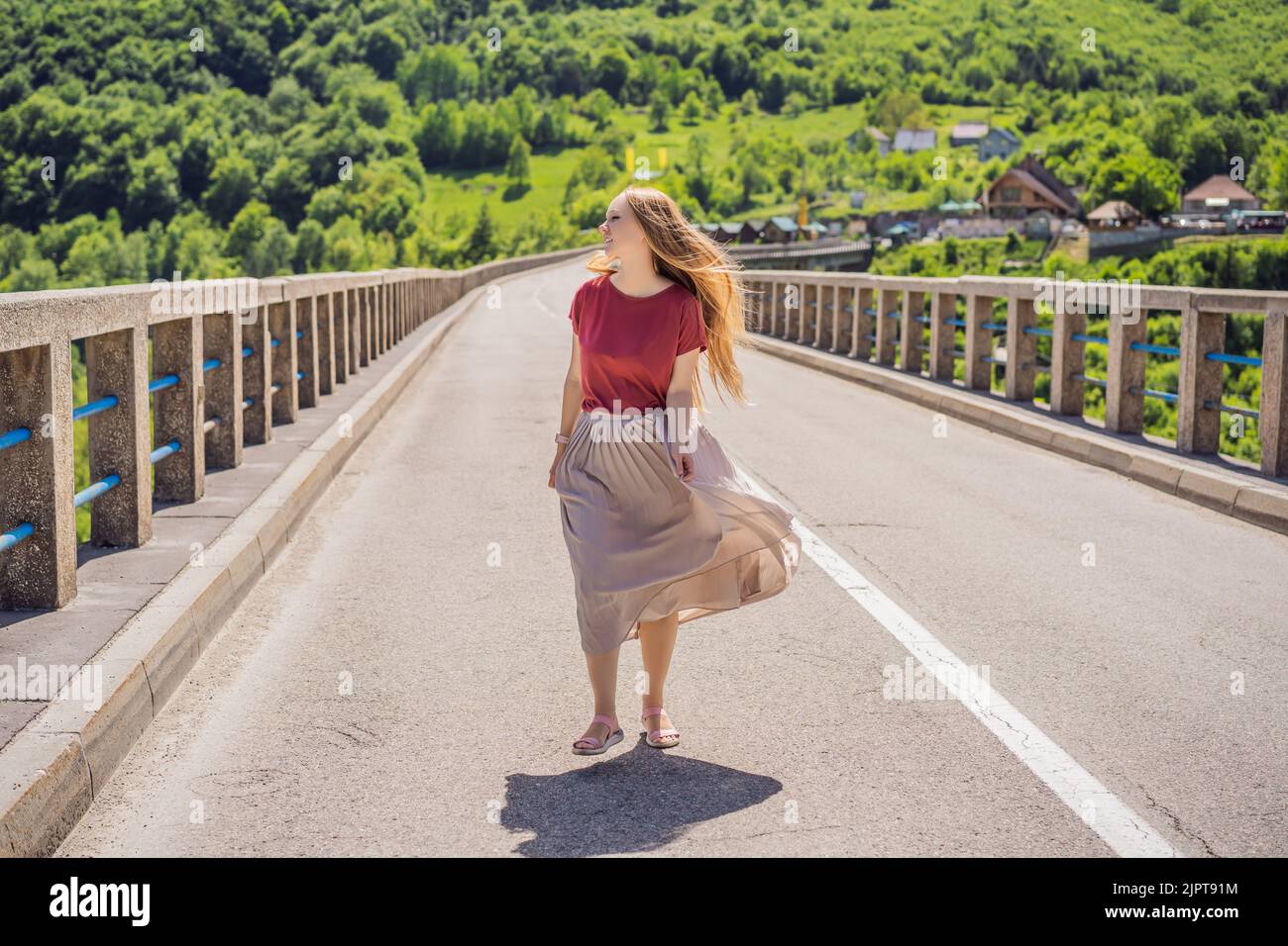 Montenegro. Woman tourist in background of Dzhurdzhevich Bridge Over ...