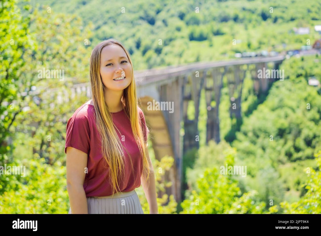 Montenegro. Woman tourist in background of Dzhurdzhevich Bridge Over ...