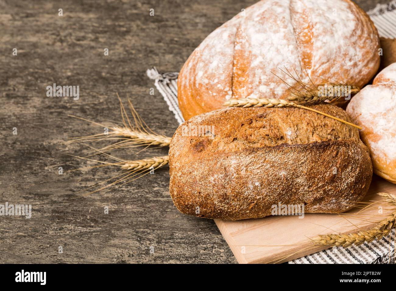 Homemade natural breads. Different kinds of fresh bread as background ...