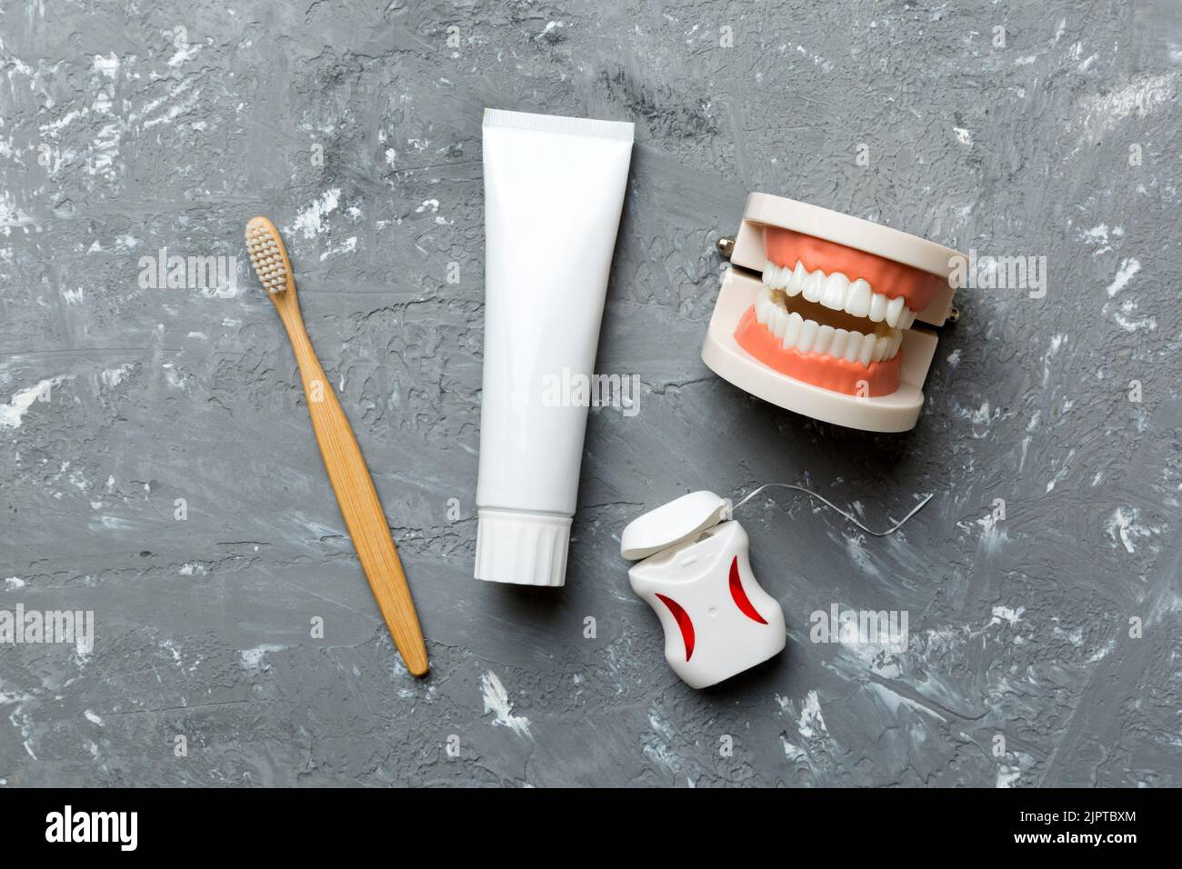 Mouthwash and other oral hygiene products on colored table top view ...