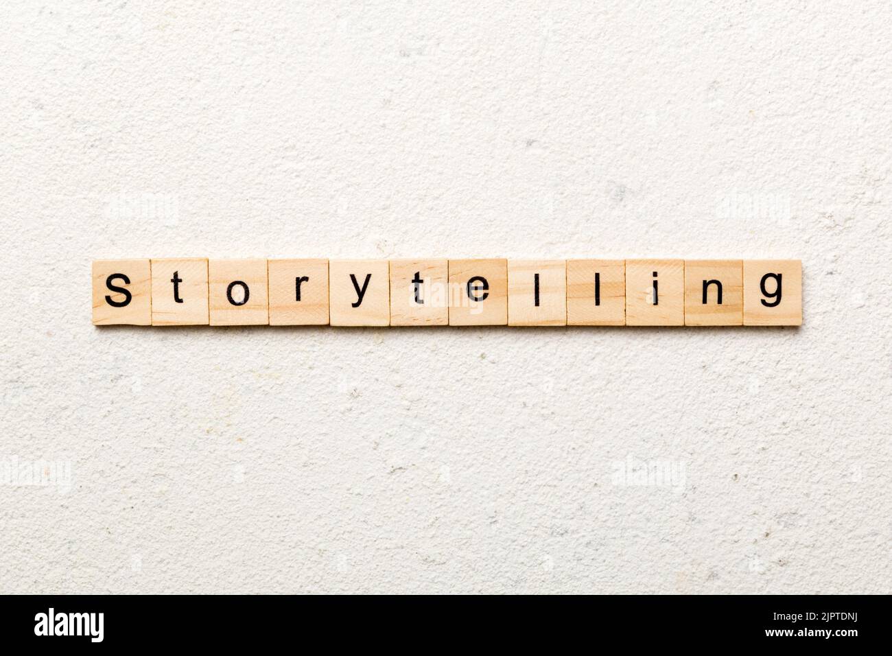 storytelling word written on wood block. storytelling text on table ...