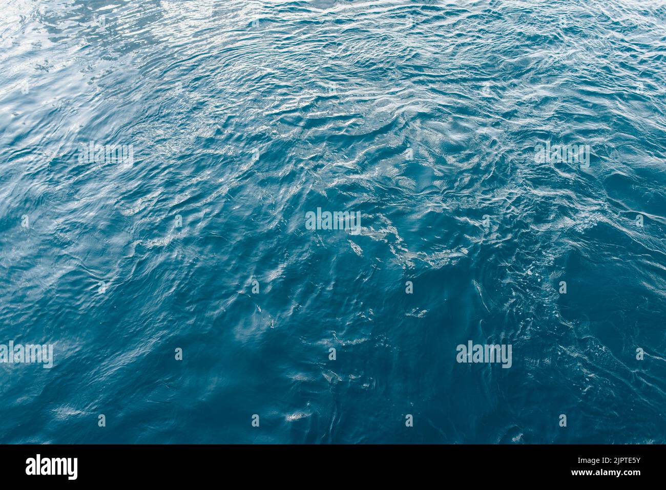 Blue sea surface with waves and ripples. Top view Stock Photo - Alamy
