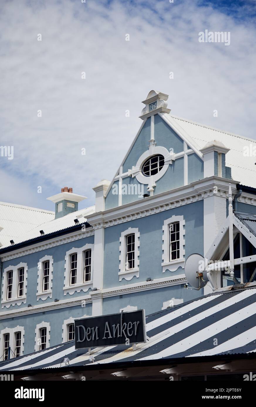 Vertical view of the historic building Der Anker on embankment in Cape ...