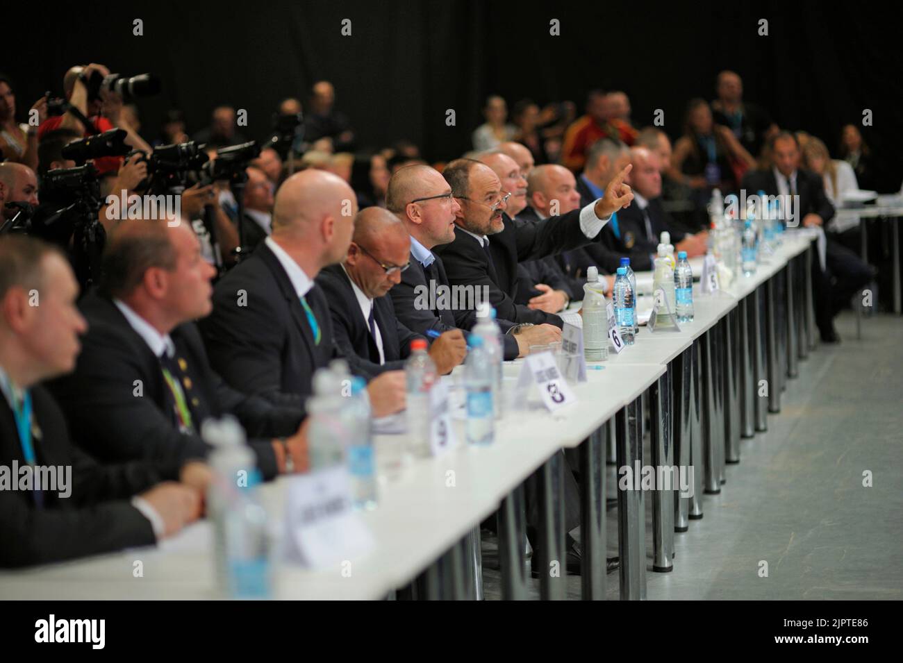 bodybuilding judges estimating performance, preparing scorecards. World ...