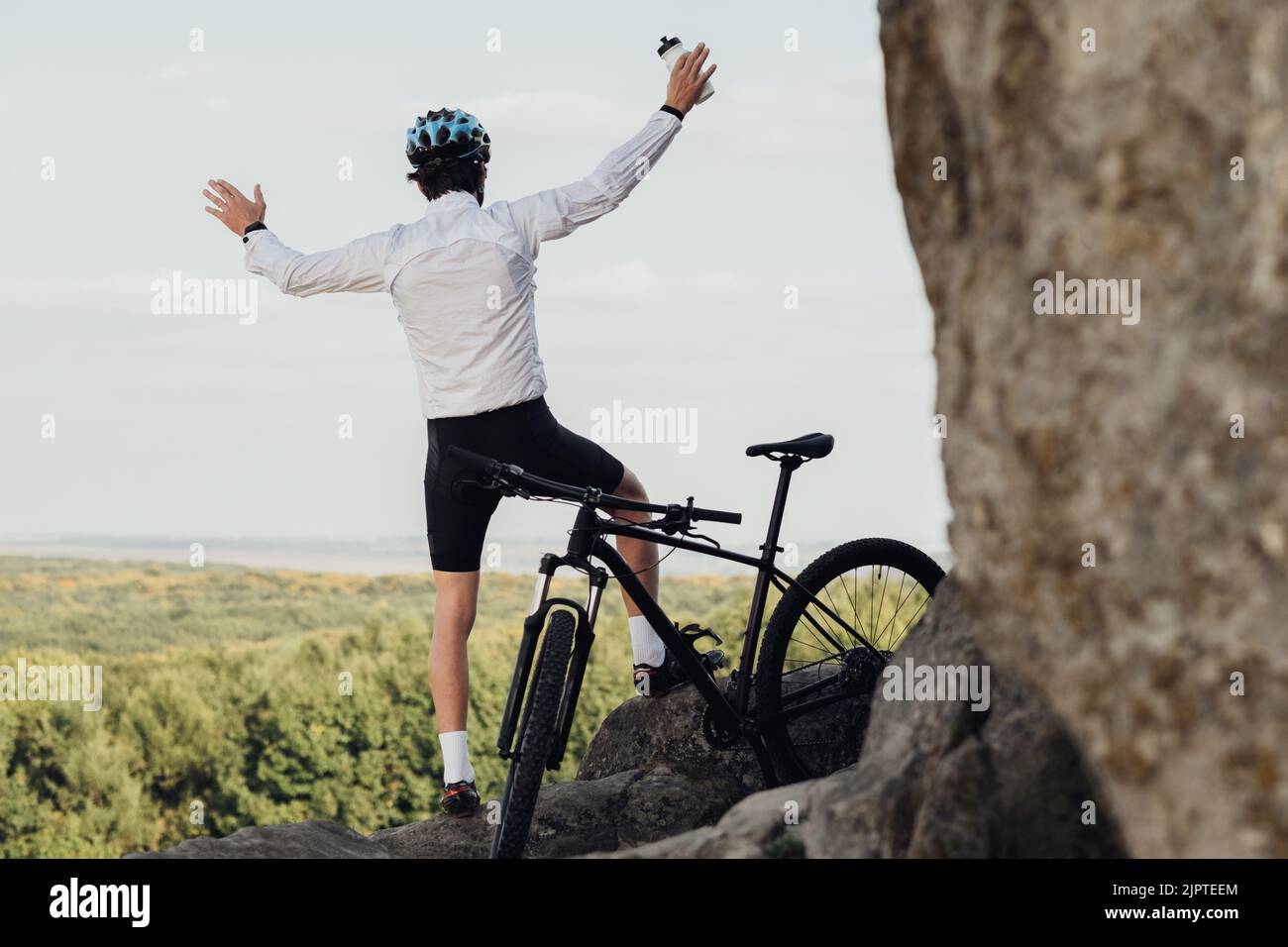 Equipped Professional Male Cyclist Sitting with Mountain Bike on the ...