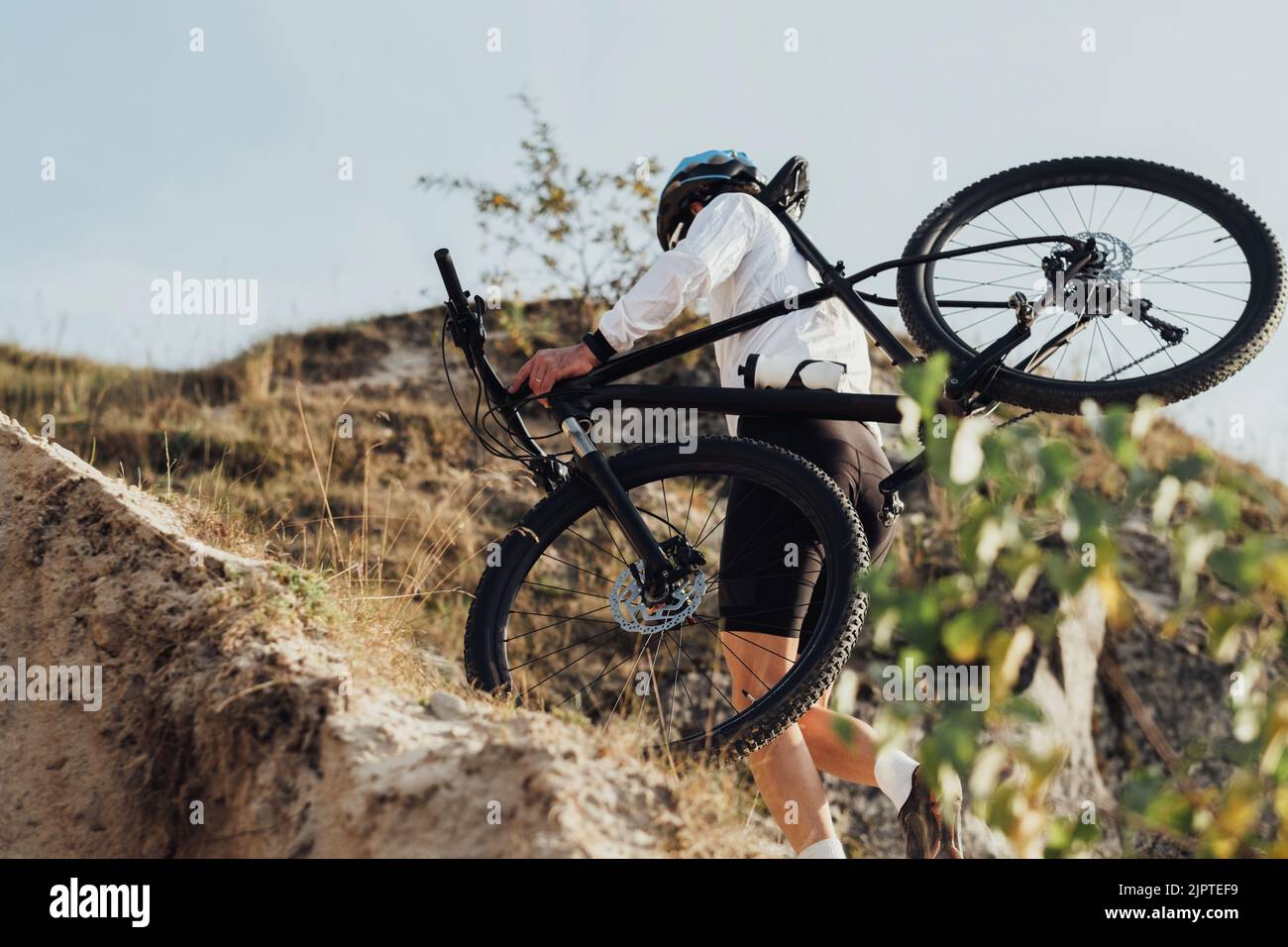 Professional Male Cyclist Carrying His Bike on Top of the Hill, Adult ...