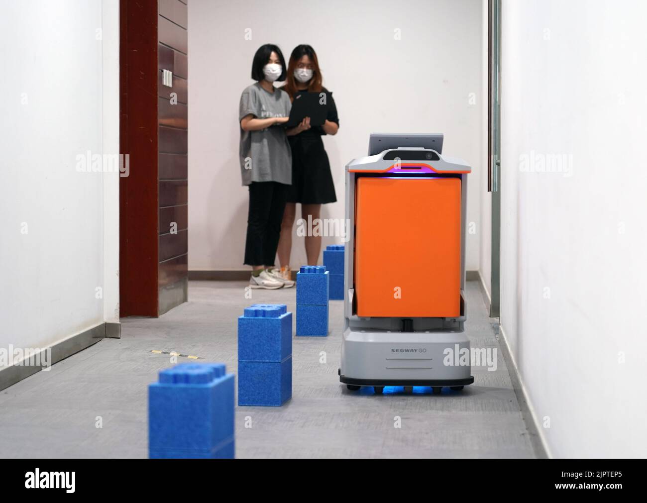 Beijing, China. 15th Aug, 2022. Engineers of a service robot company ...