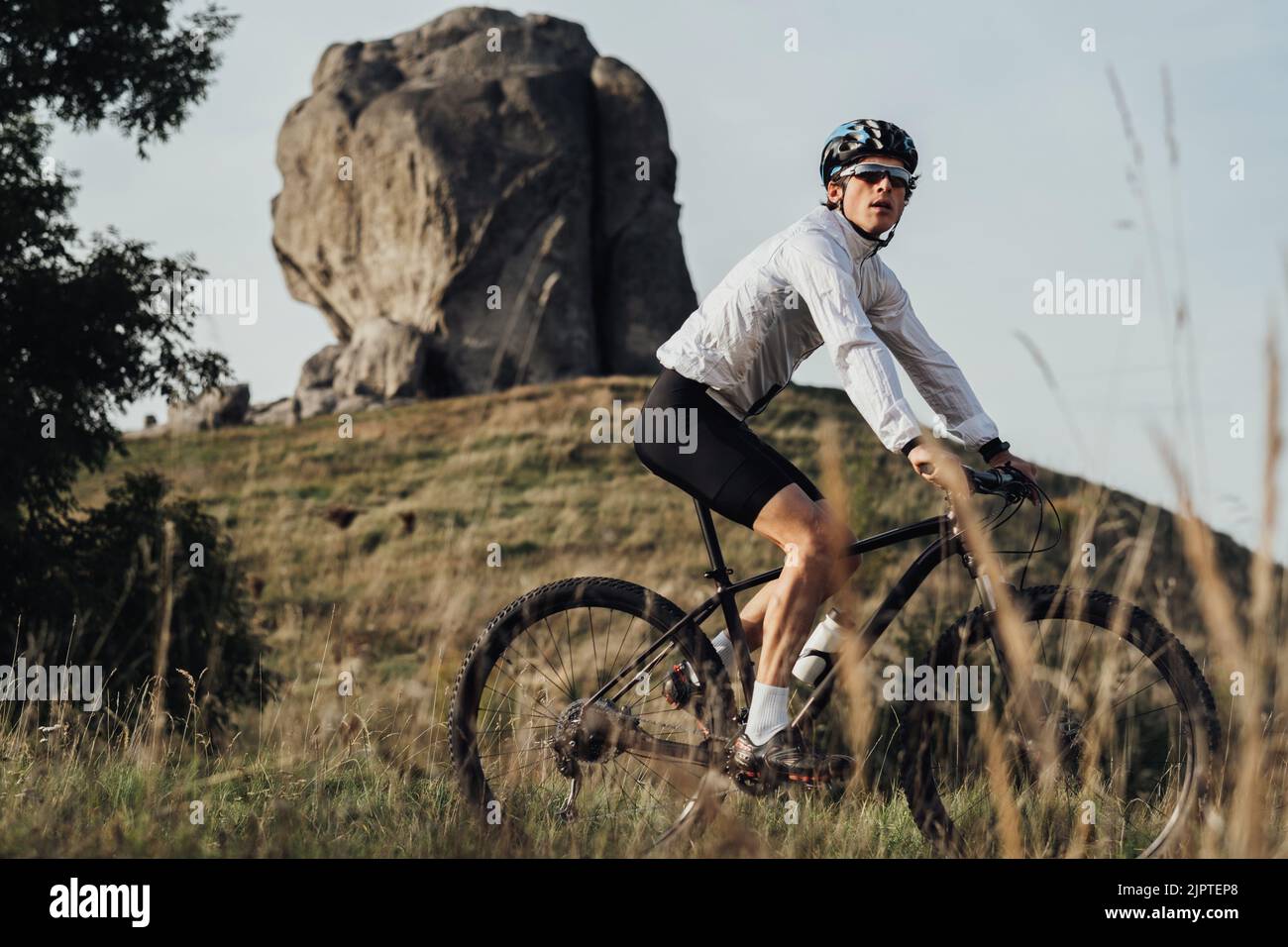Professional Equipped Cyclist on Trail with Giant Stone, Miracle of ...