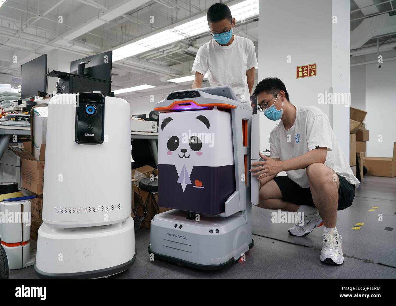 Beijing, China. 15th Aug, 2022. Engineers of a service robot company ...