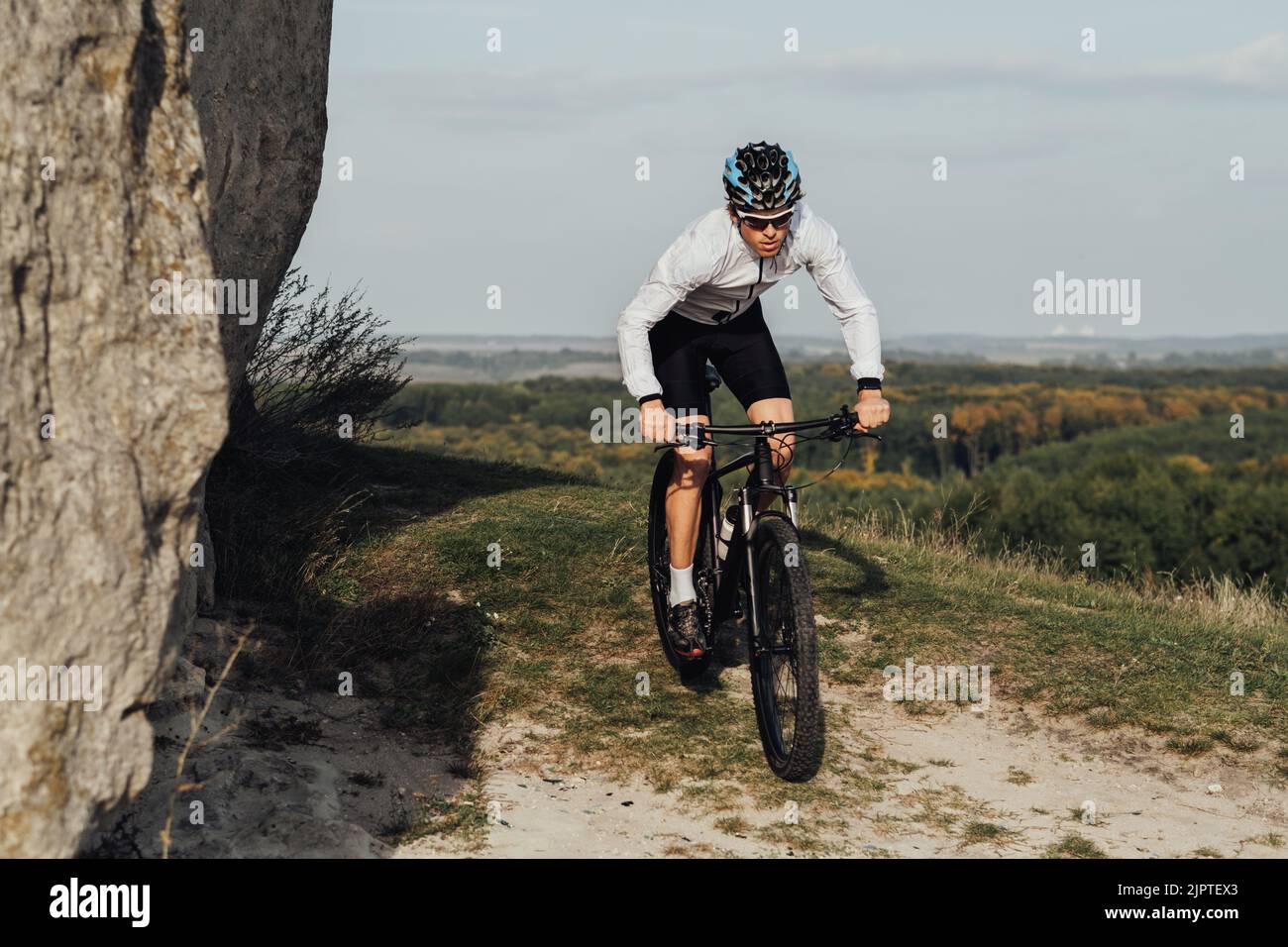 Equipped Professional Male Cyclist Riding Bike Outdoors on Top of the ...