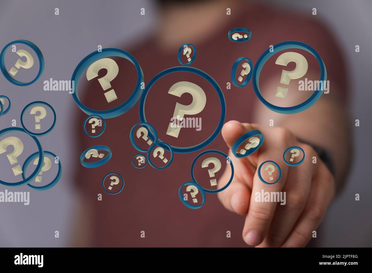 A man's hand pressing a group of illustrative question marks Stock ...