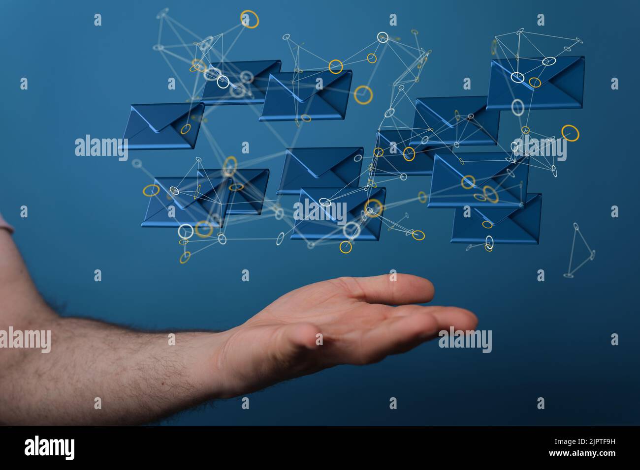 A man's hand pointing at illustrative email icons floating over his ...