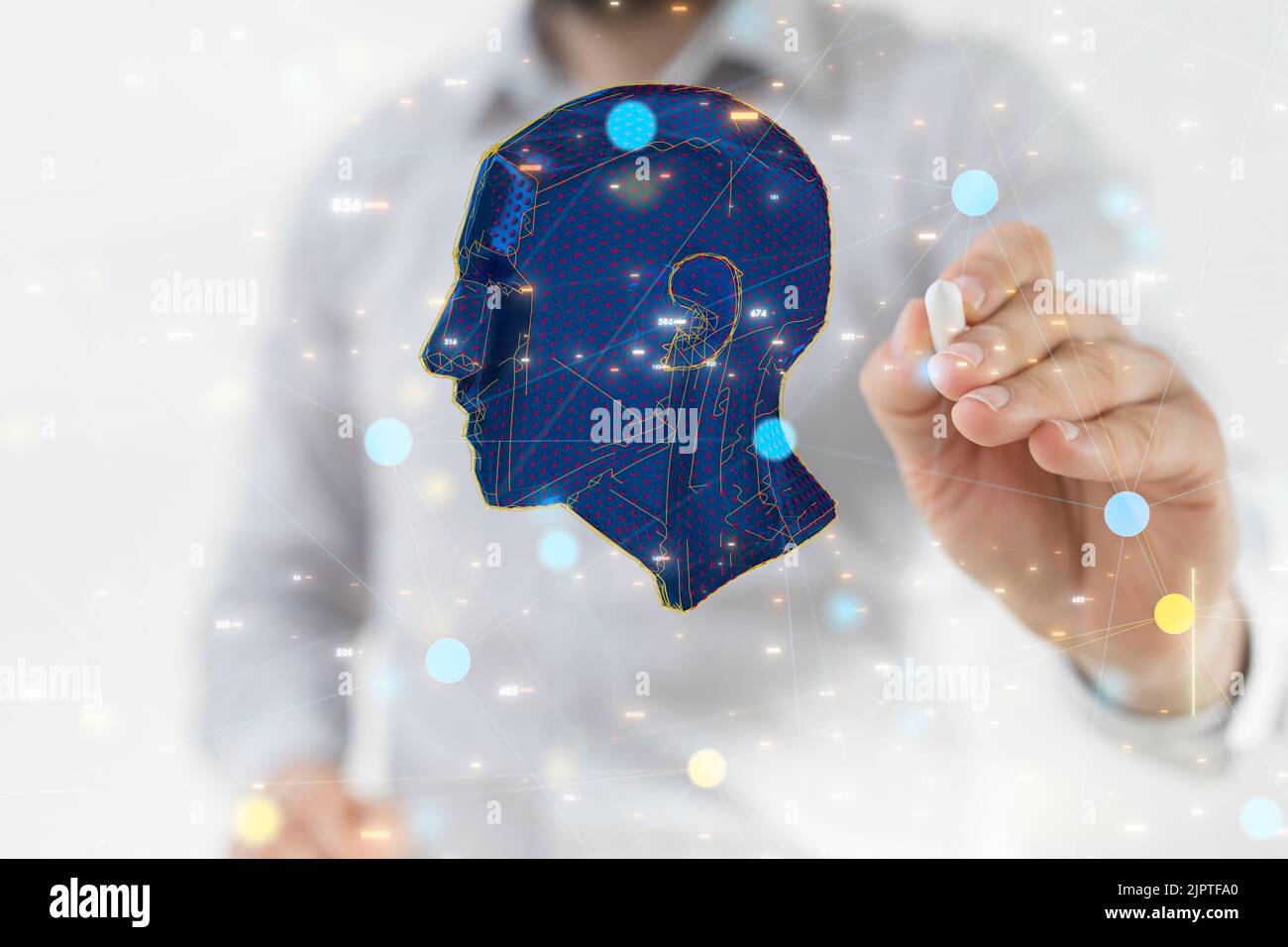 A man's hand pressing an illustrative human head with a digital pen ...