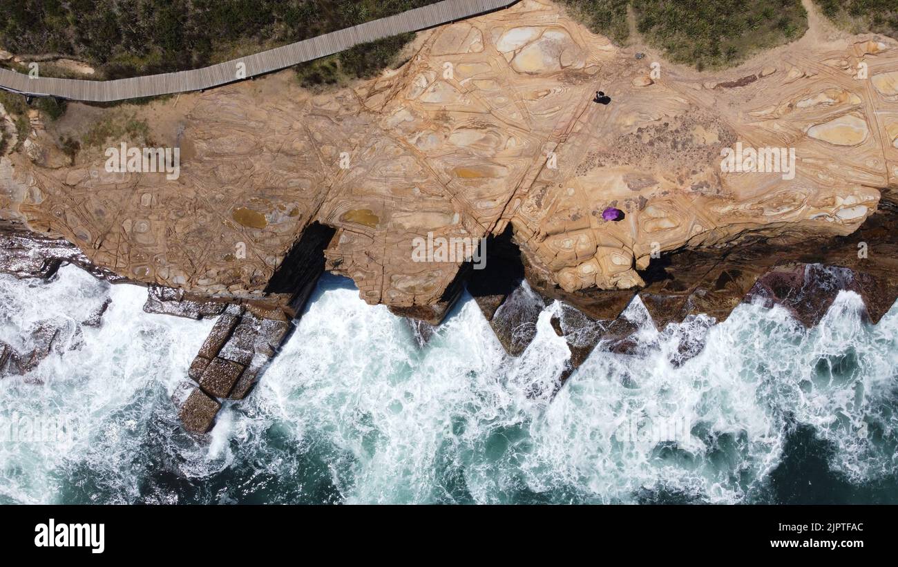 An top view of the special rock with foamy waves in Central coast ...