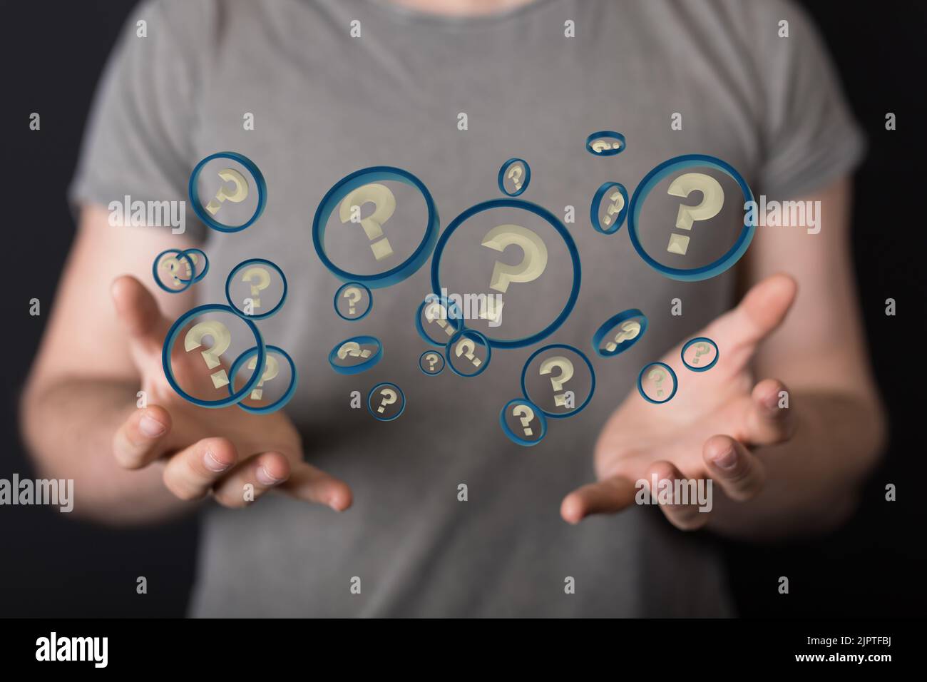 A group of illustrative question marks floating over a man's hands Stock Photo - Alamy