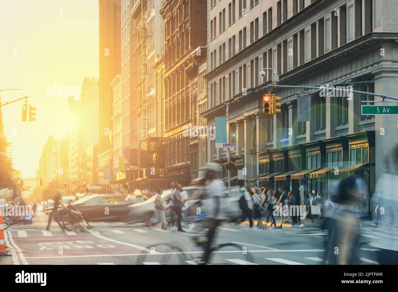 Busy downtown street scene with crowds of people walking through a ...