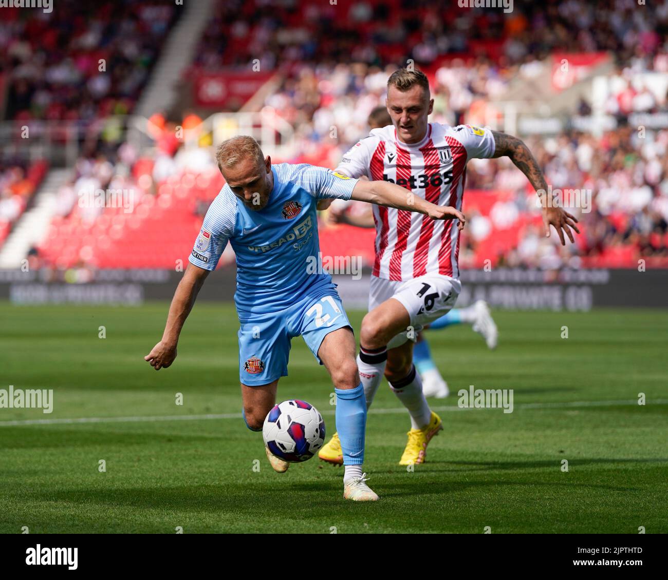 Ben Wilmot #16 of Stoke City competes for the ball with Alex Pritchard ...