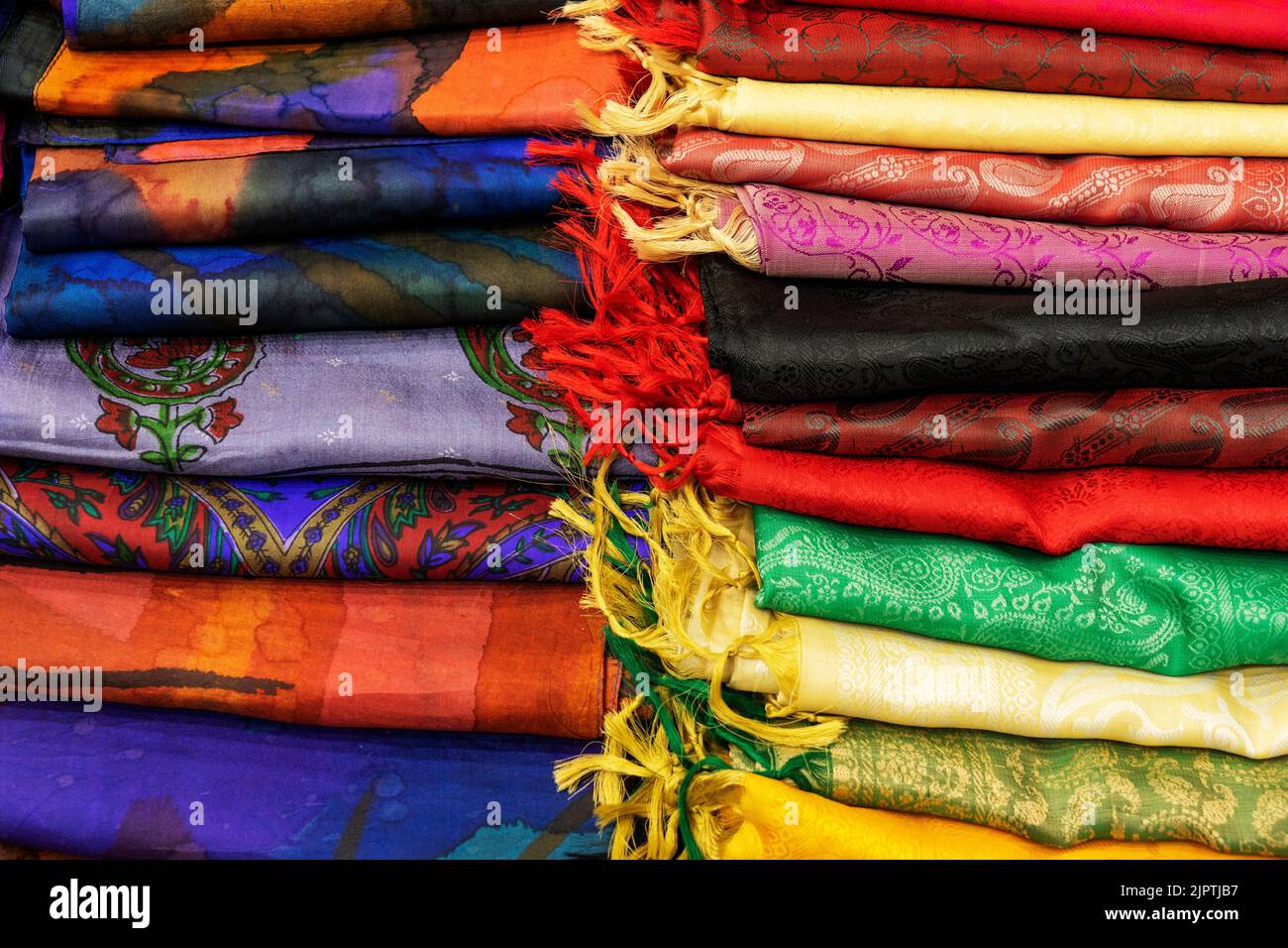 multicolored Indian women's shawls made of silk and cotton in the shop ...