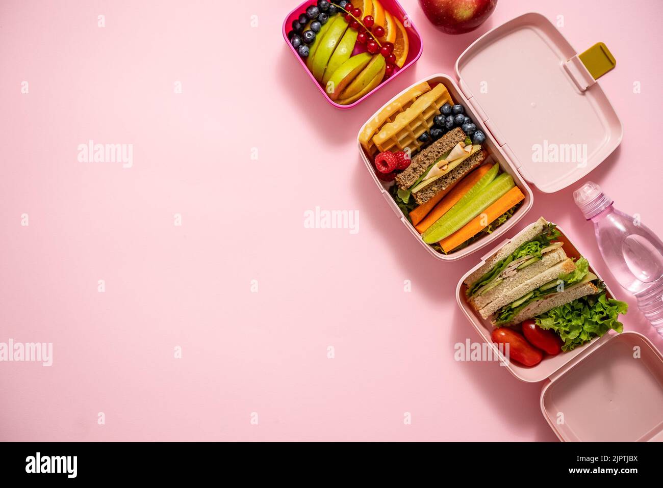 Healthy lunch to go. Sandwitches, Fruits and vegetables packed in lunch ...