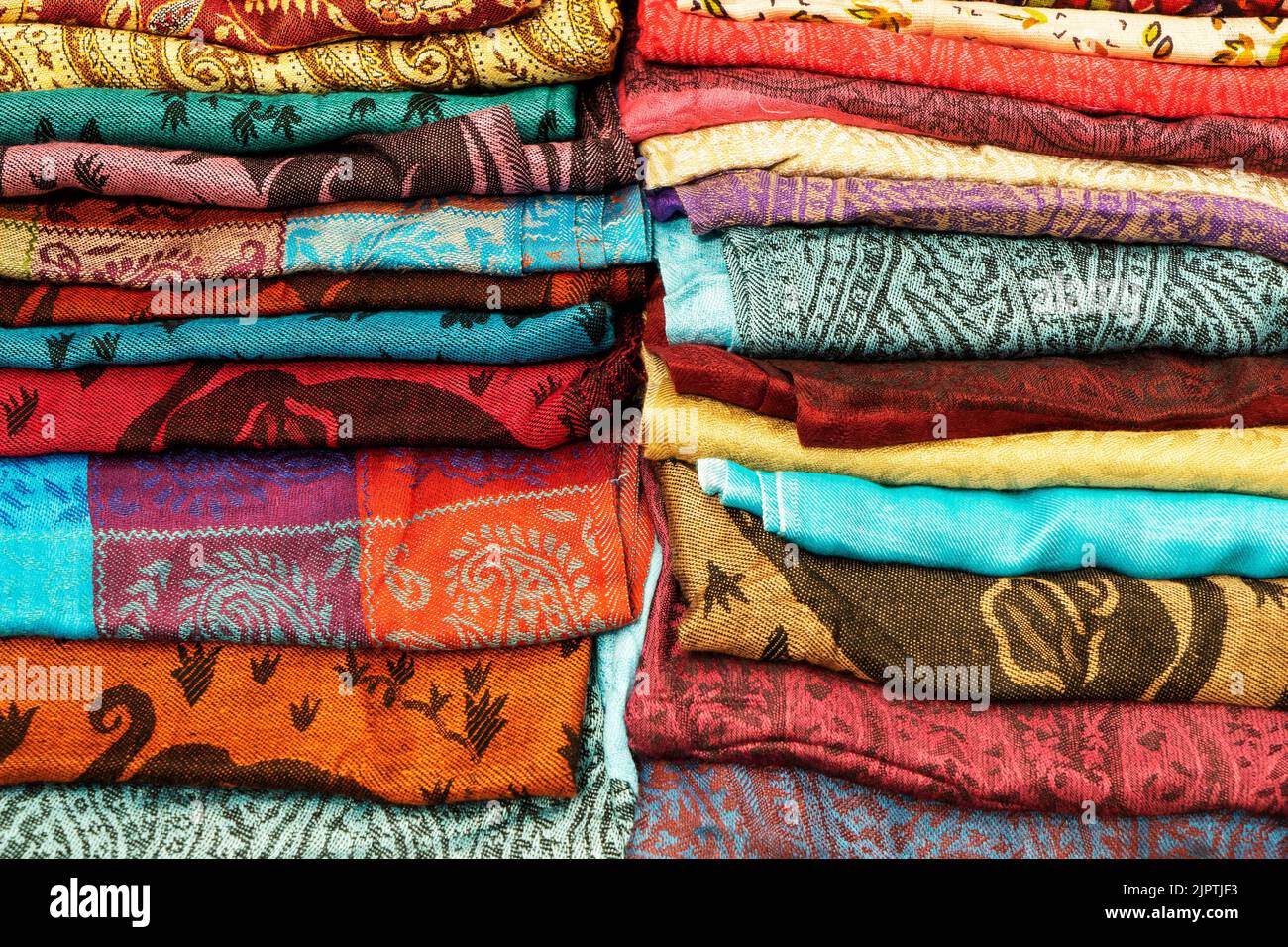 multicolored Indian women's shawls made of silk and cotton in the shop ...