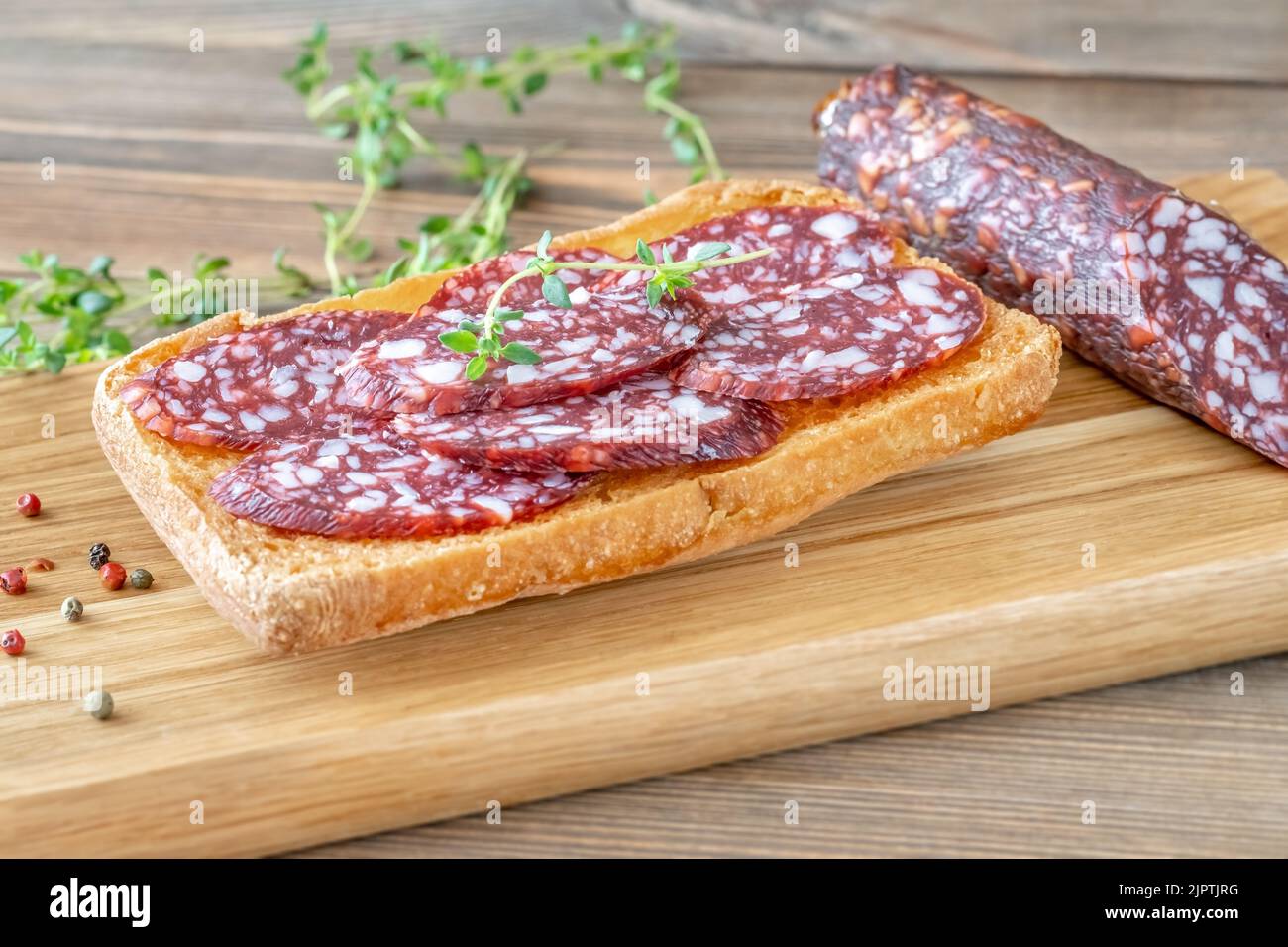 Sandwich wit Braunschweiger sausage on the wodden cutting board Stock ...