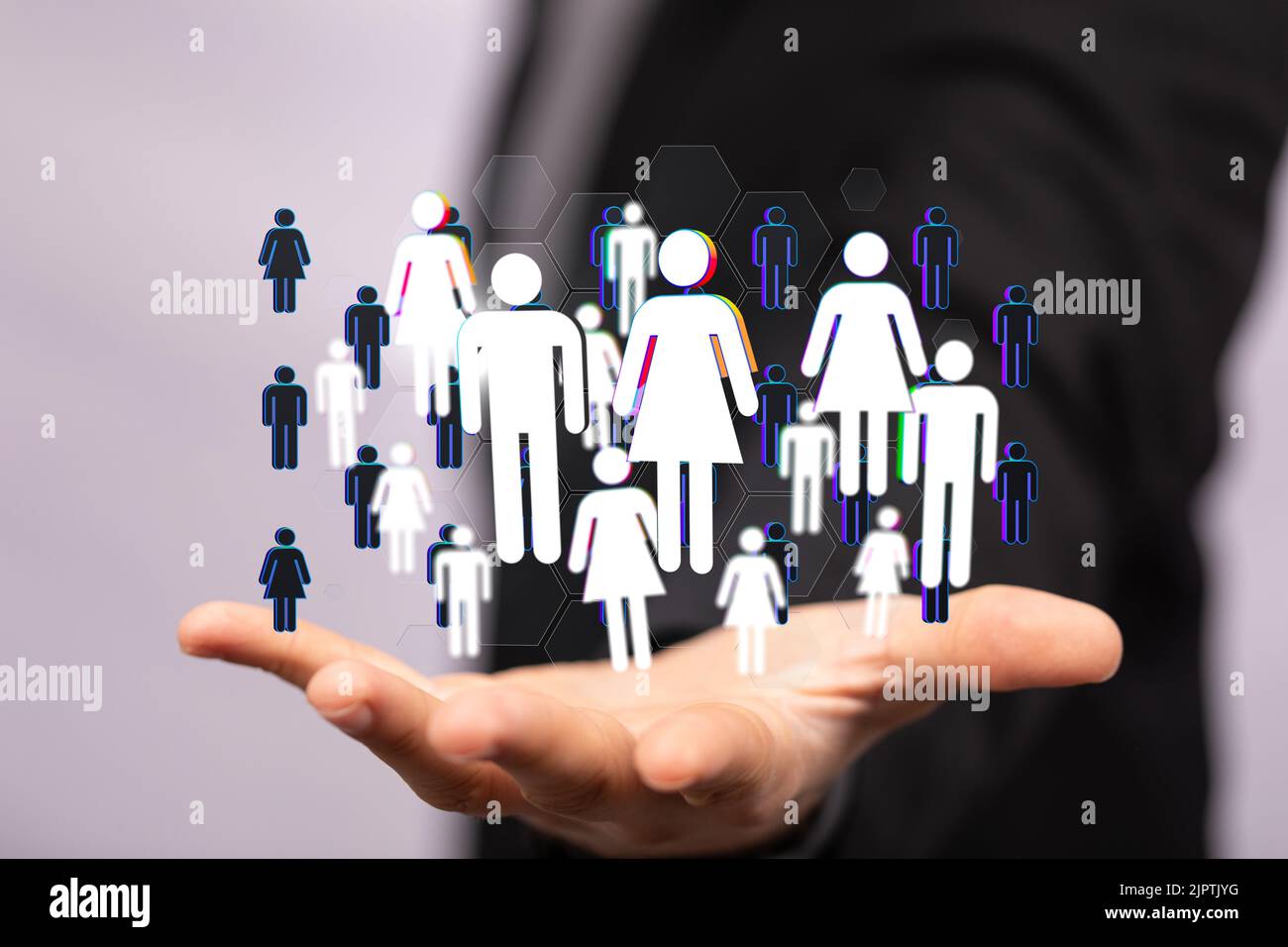 The 3d rendered people icons hovering over a man's hand Stock Photo - Alamy