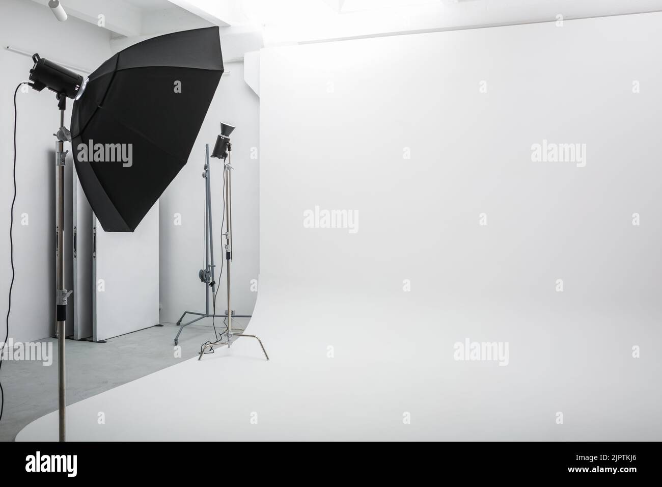 interior of bright space of photo studio with large white cyclorama ...