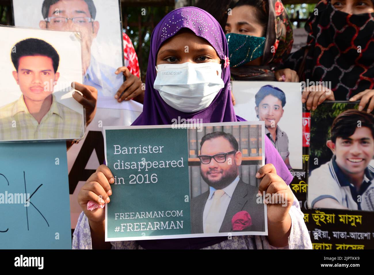 Dhaka, Bangladesh. 20th Aug 2022. Relatives hold portraits of their missing family members ...