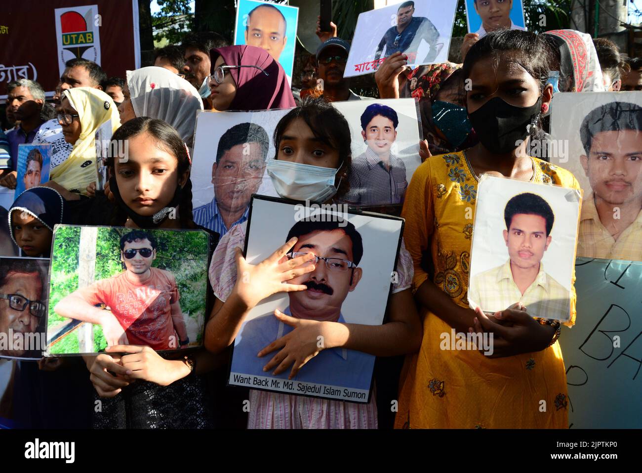Dhaka, Bangladesh. 20th Aug 2022. Relatives hold portraits of their missing family members ...