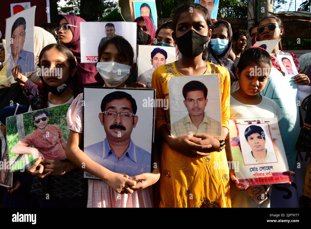 Dhaka, Bangladesh. 20th Aug 2022. Relatives hold portraits of their missing family members ...