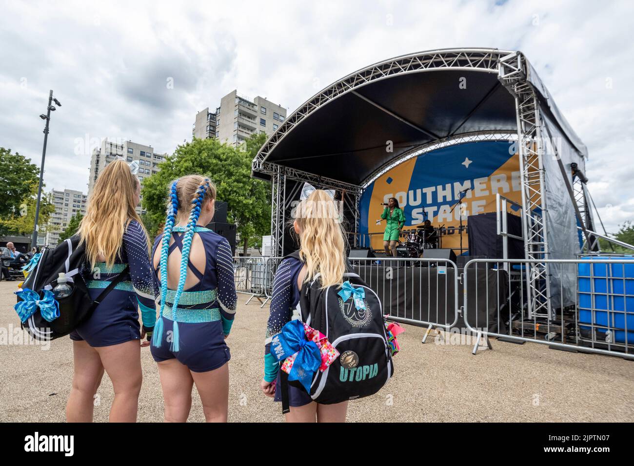 London, UK. 20 August 2022. Members of cheerleading group Utopia watch ...