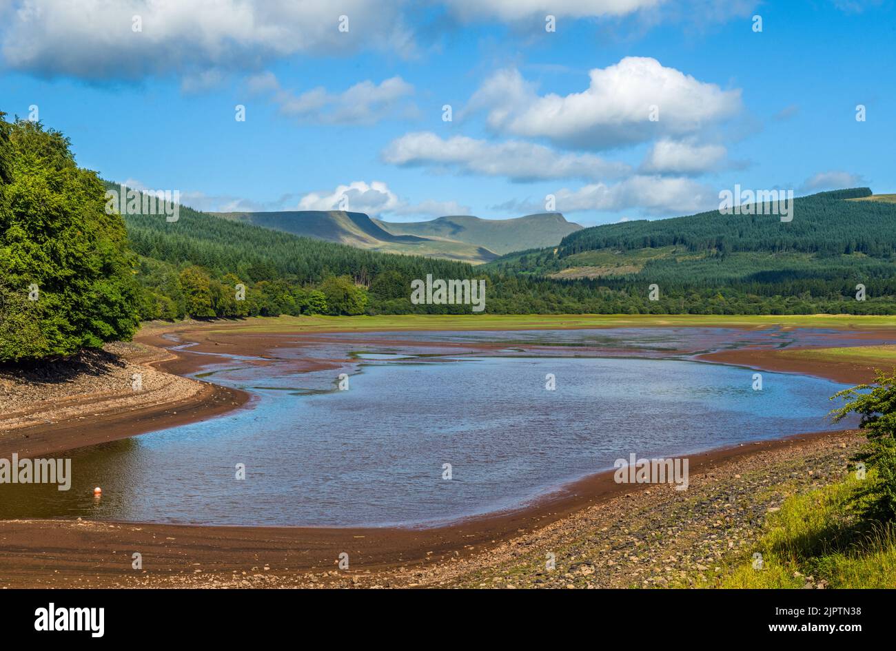 A very low Pentwyn Reservoir in Summer with Corn Du and Pen y Fan in ...