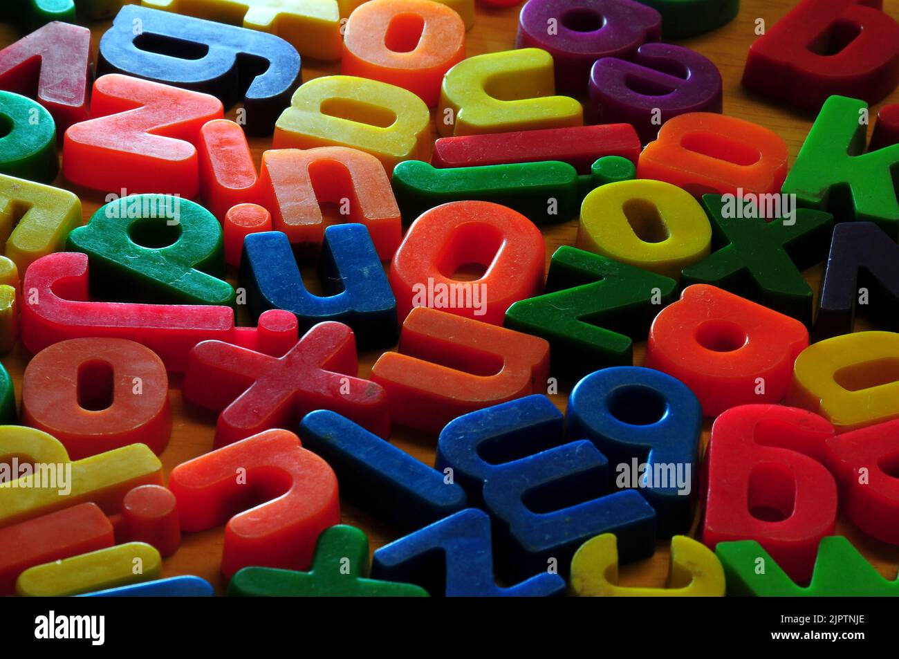 Assortment of plastic alphabet fridge magnets Stock Photo - Alamy