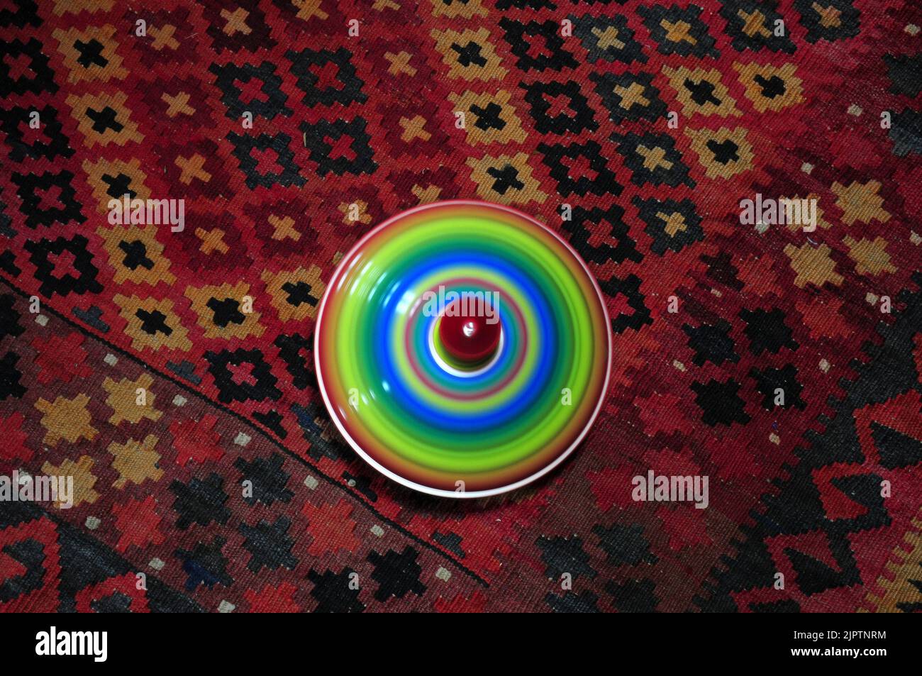 Spinning top in motion photographed from above Stock Photo - Alamy