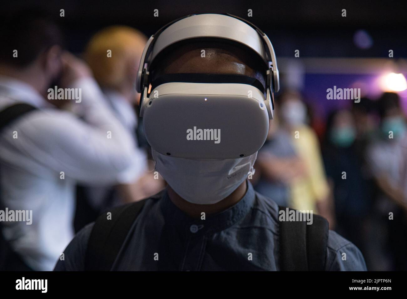 A visitor experiences a virtual reality (VR) at the Thailand Metaverse ...