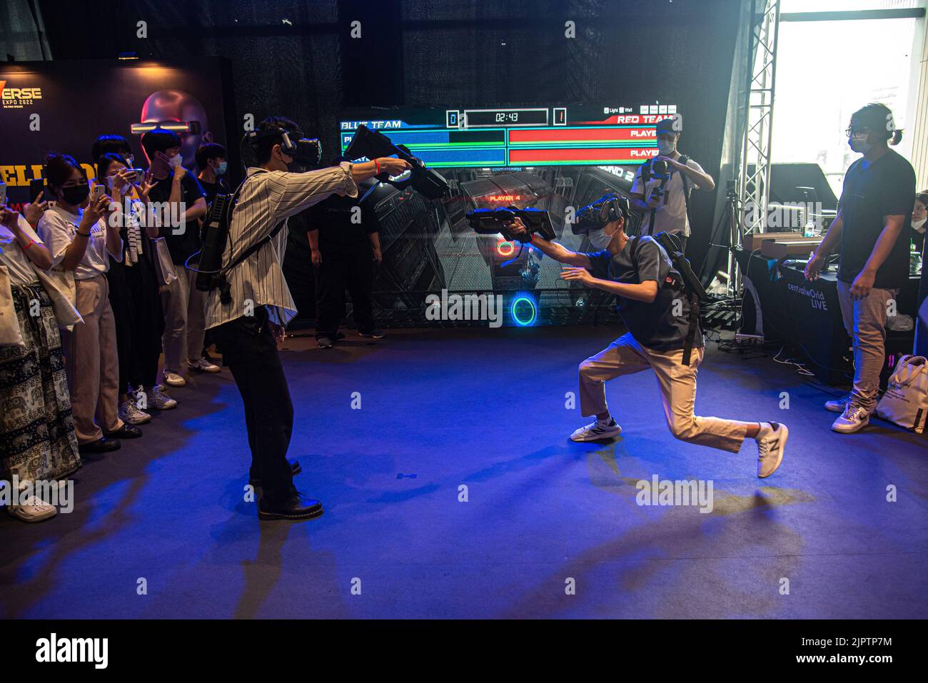 Visitors experience a virtual reality (VR) on a battleground game at ...