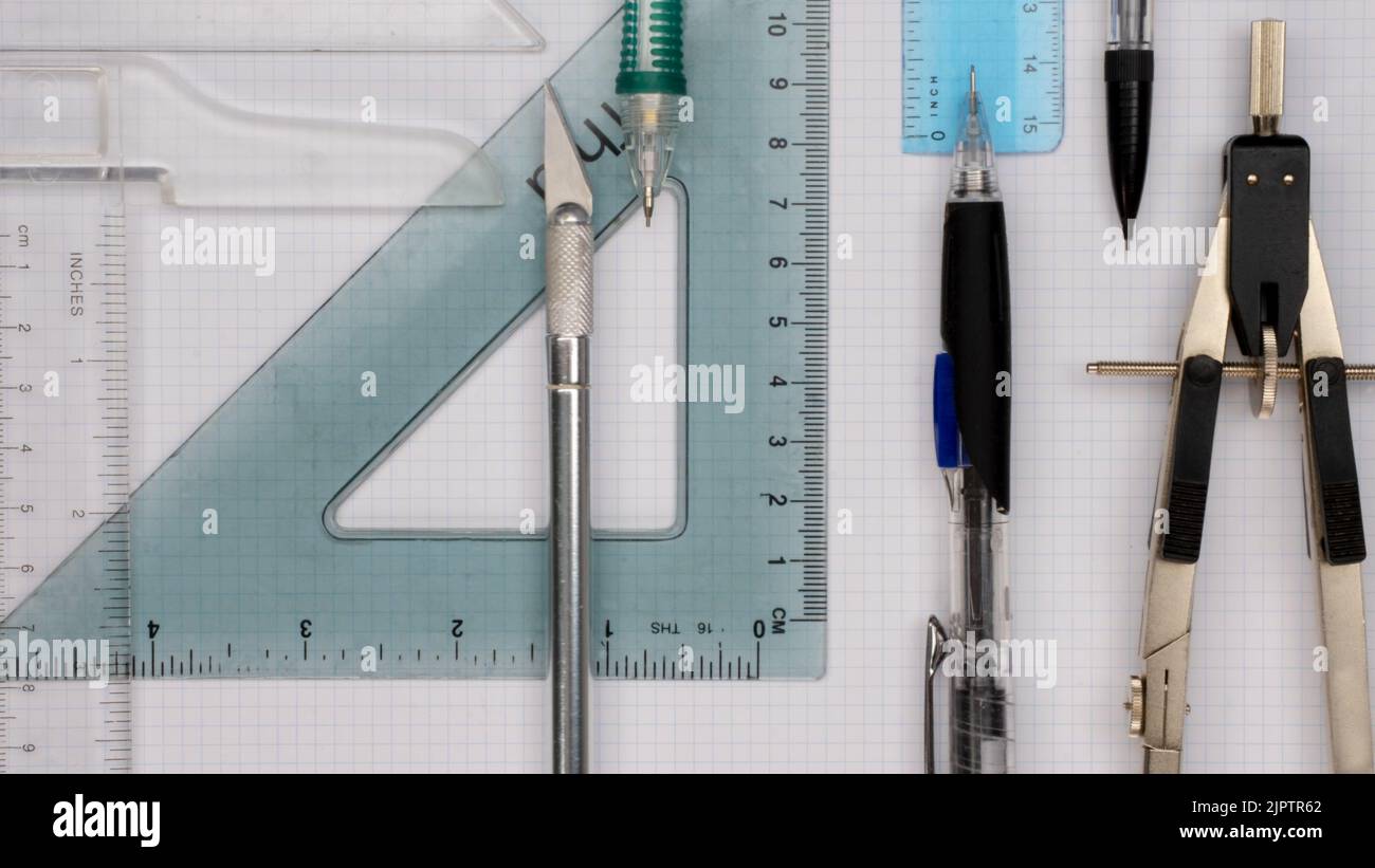 Drafting architectural tools arranged on white quartile paper flay lay ...