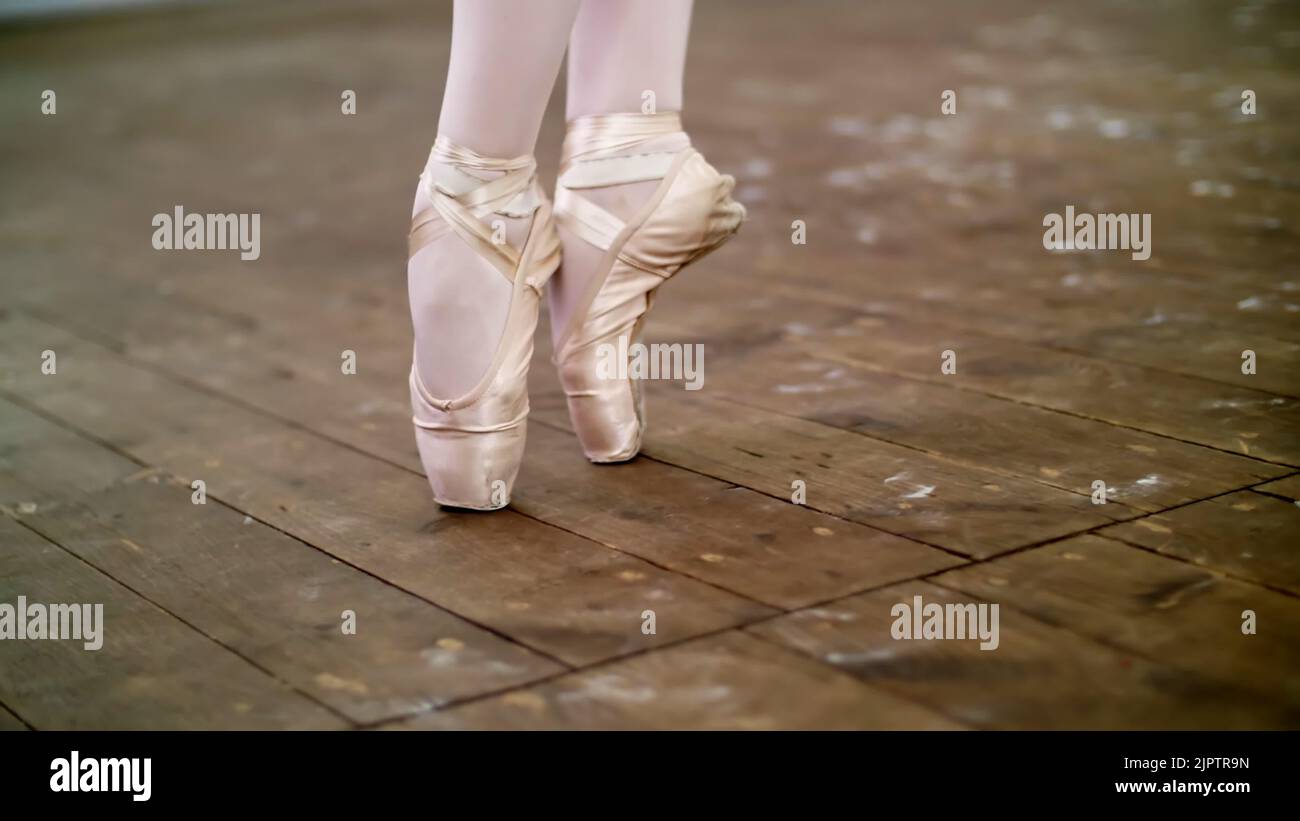 close up, in dancing hall, ballerina perform step pointe , She is ...
