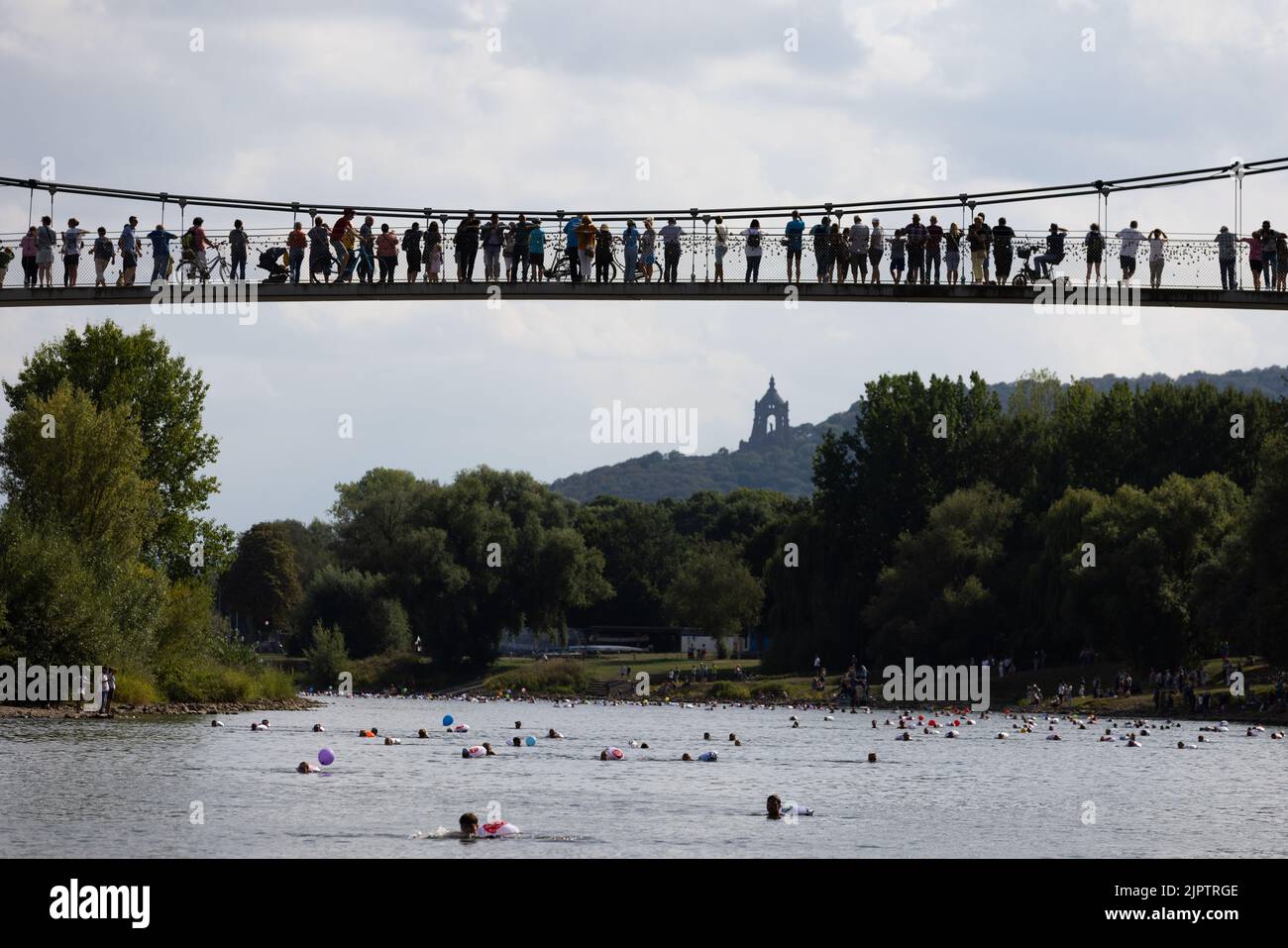 Minden, Germany. 20th Aug, 2022. Swimmers swimming in the Weser ...