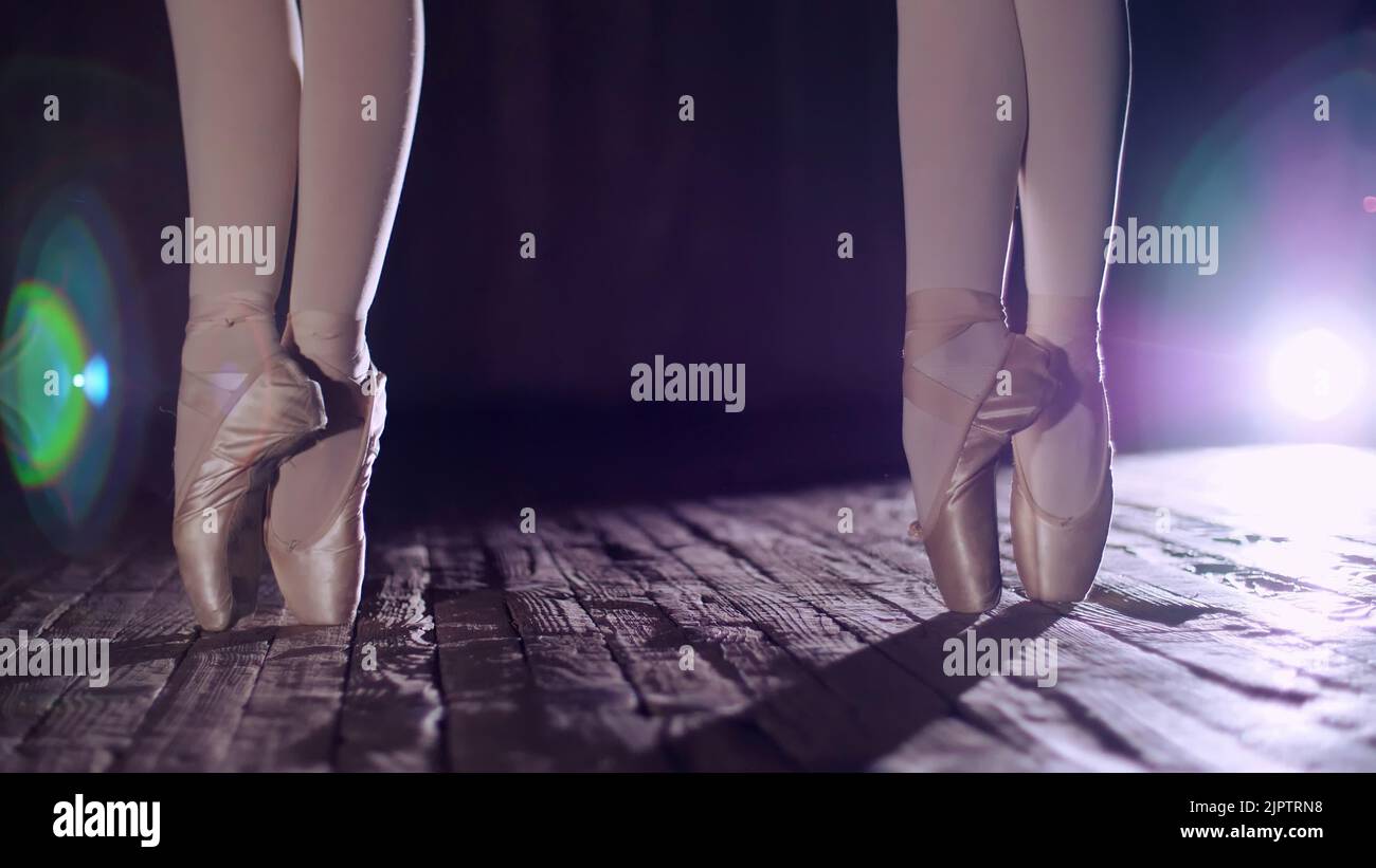 close up, in rays of spotlight, on the stage of the old theater hall ...