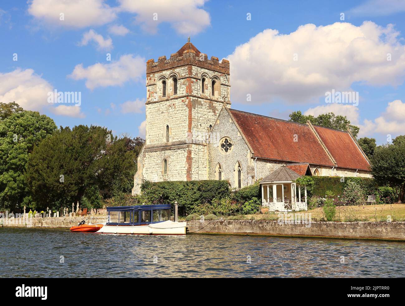 English Village Church and Tower on the river Thames at Bisham, with ...