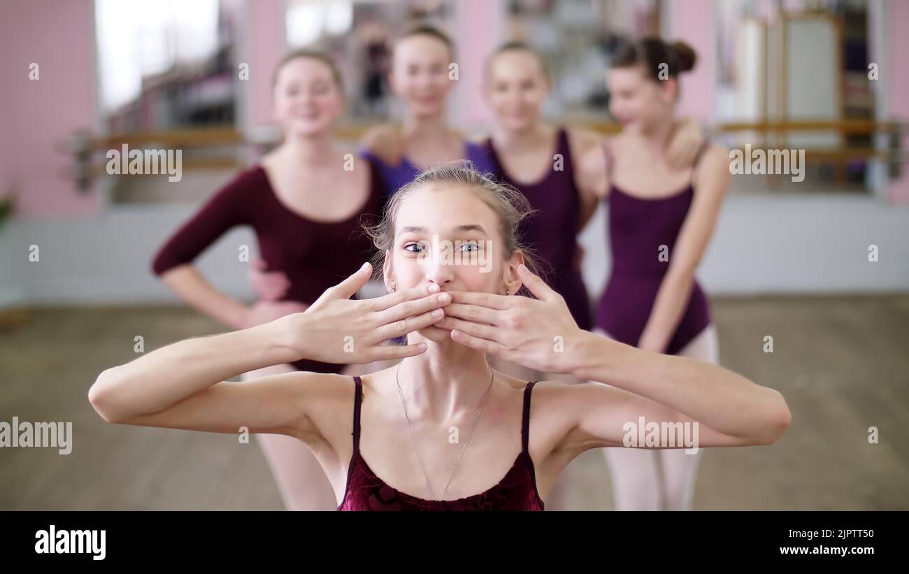 portrait of a young girl ballet dancer in a lilac ballet leotard ...