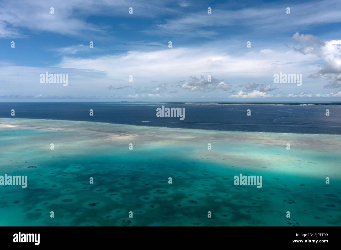 Aerial view of turquoise colored ocean and reef in Semporna Sabah ...