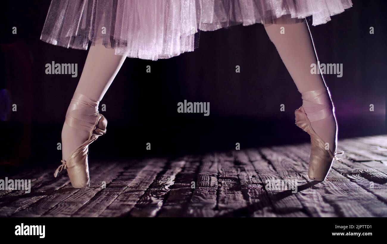 close up, in rays of spotlight, on the stage of the old theater hall ...